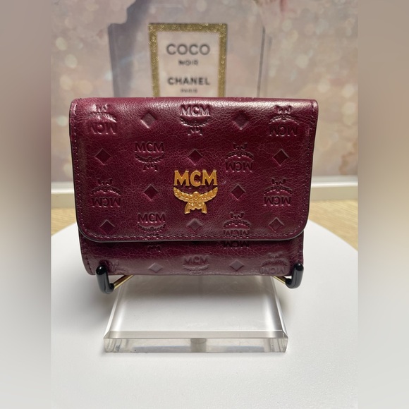MCM | Bags | Embossed Mcm Maroon Leather Mini Wallet With Gold Logo ...